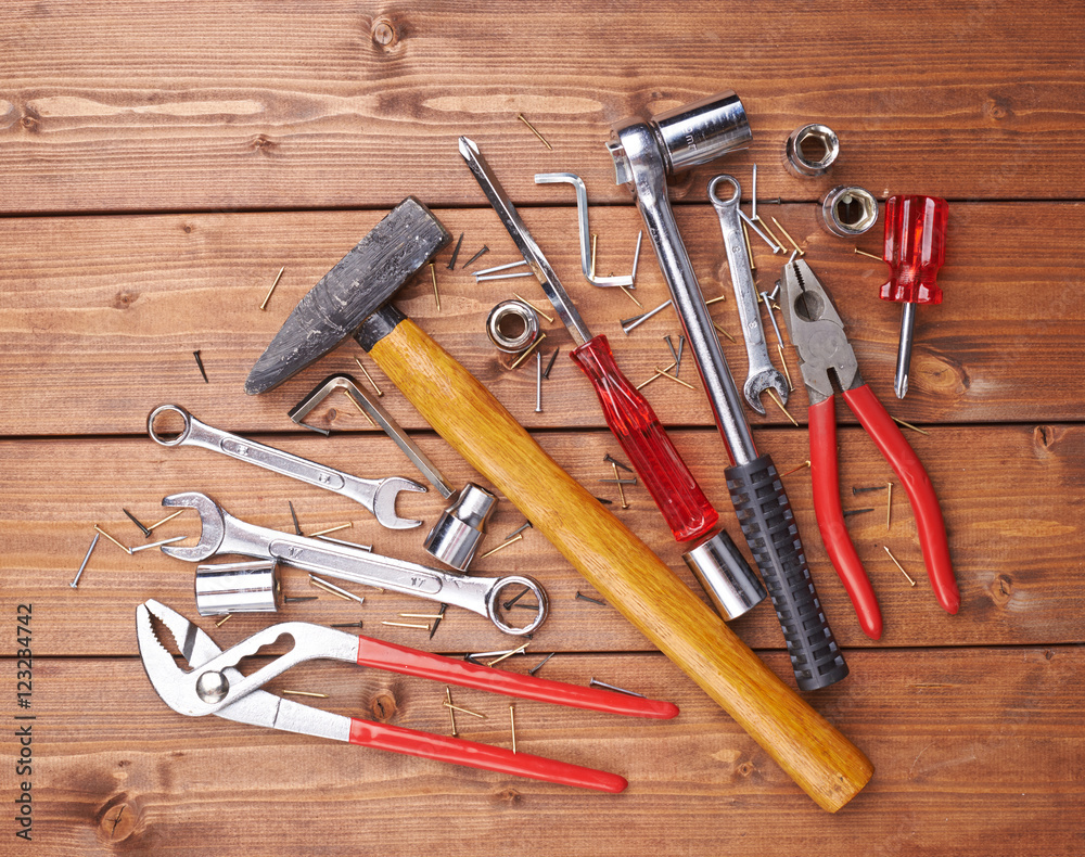 Foto De Set Of Different Work Tools On Wooden Surface Do Stock Adobe