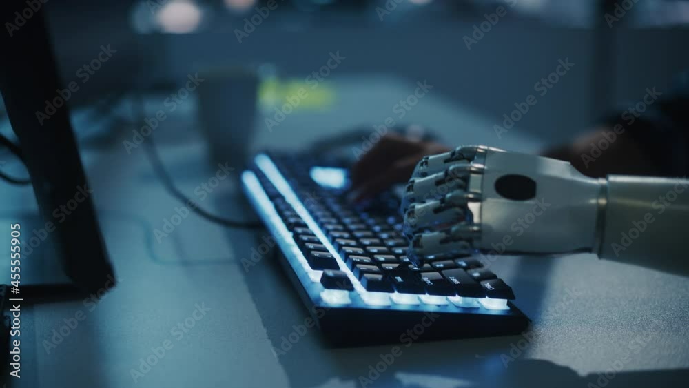 Close Up On Hands Programmer With Disability Using Prosthetic Arm To