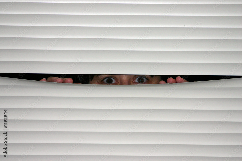 person peeking through blinds Stock Photo | Adobe Stock