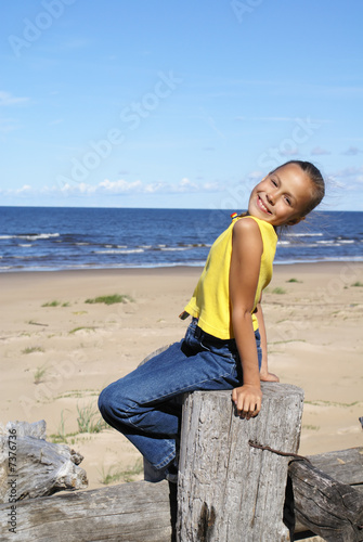 Preteen girl on a beach Stock Photo | Adobe Stock