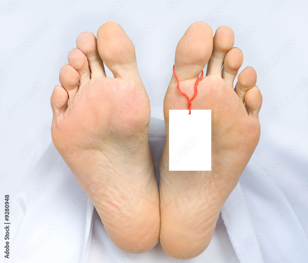 Two feet of a dead body with an identification tag blank sign Stock ...