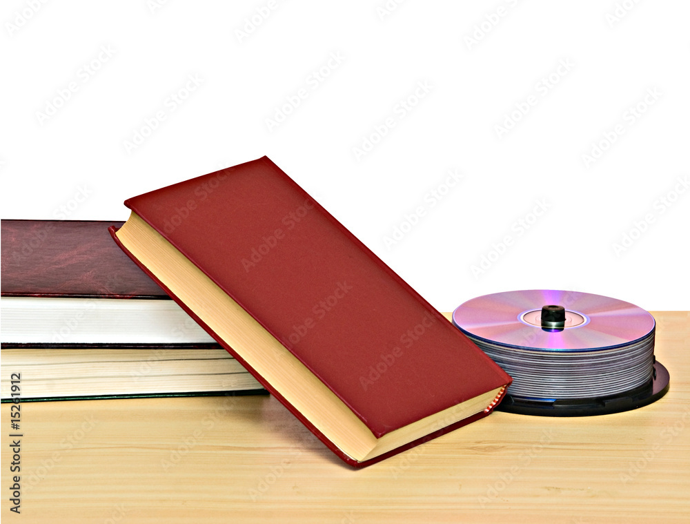 Pile of books and DVD disk pack as symbols of old and new metho Stock ...