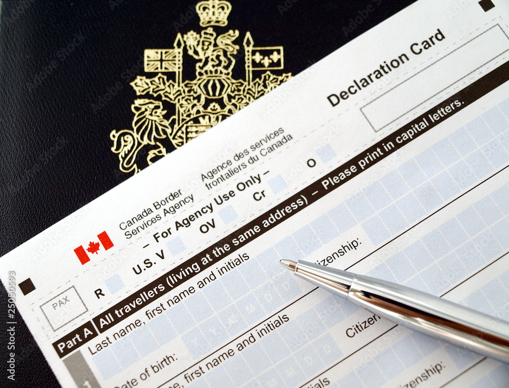 Canada passport on declaration card with pen Stock Photo | Adobe Stock