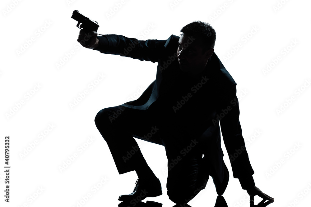 silhouette man kneeling aiming gun Stock Photo | Adobe Stock