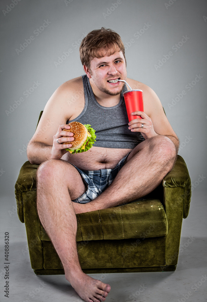 fat man eating hamburger Stock Photo | Adobe Stock