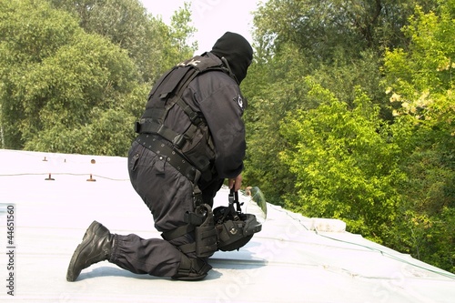 kneeling policeman Stock Photo | Adobe Stock