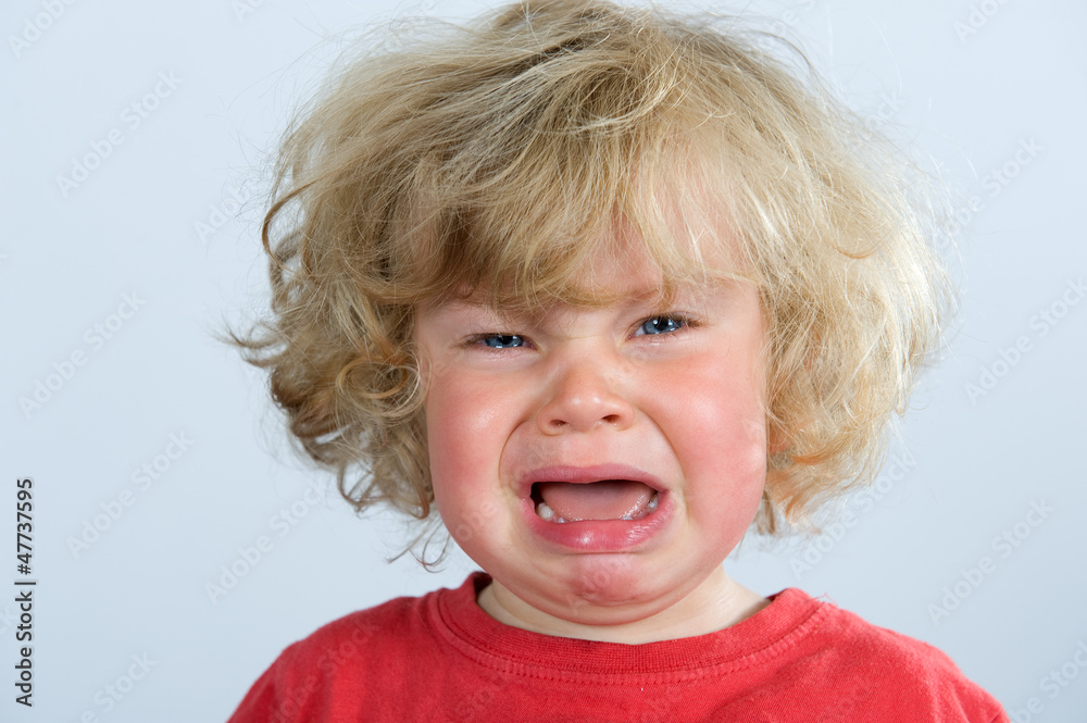 little child is crying Stock Photo | Adobe Stock