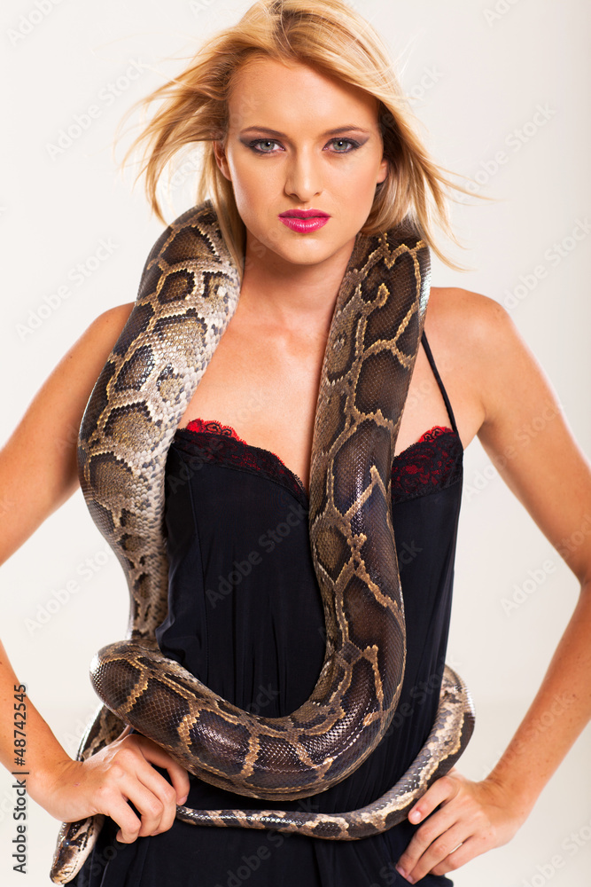 sexy blonde woman posing with python Stock Photo | Adobe Stock