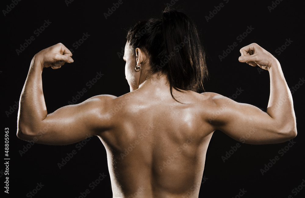 Back muscles of naked fitness woman. Stock Photo | Adobe Stock