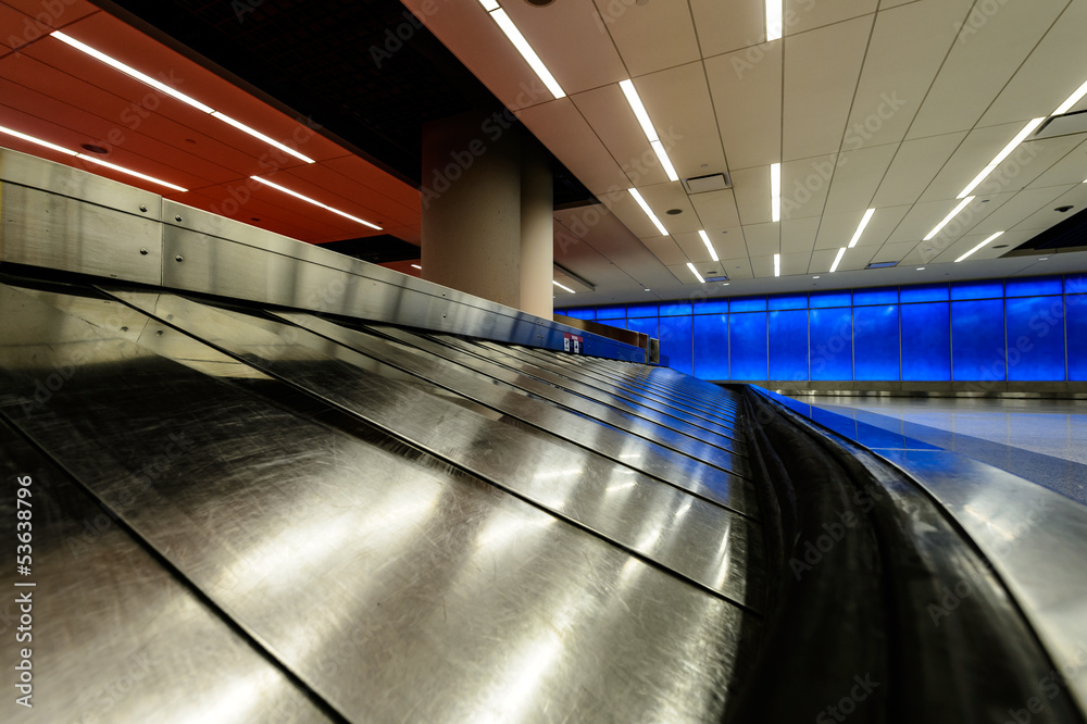 Baggage carousel at the airport. Baggage claim. Stock Photo | Adobe Stock