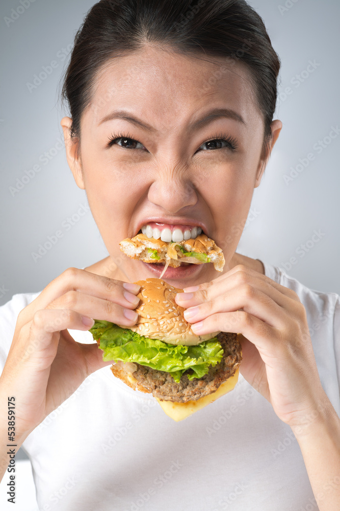 Hamburger eater Stock Photo | Adobe Stock