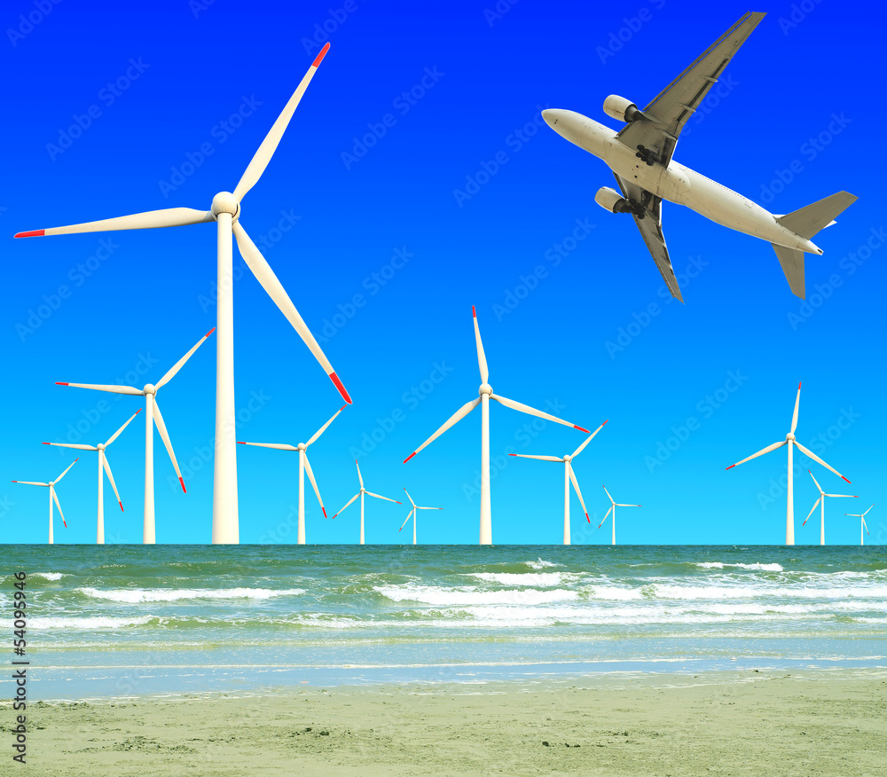 Aircraft is flying in eco power of wind turbines in the sea skyl Stock ...