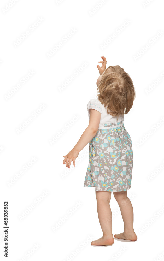 Little baby girl showing something above her Stock Photo | Adobe Stock