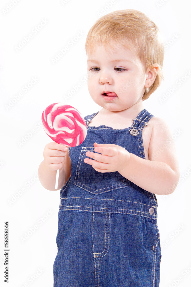 Baby with lollipop Stock Photo | Adobe Stock