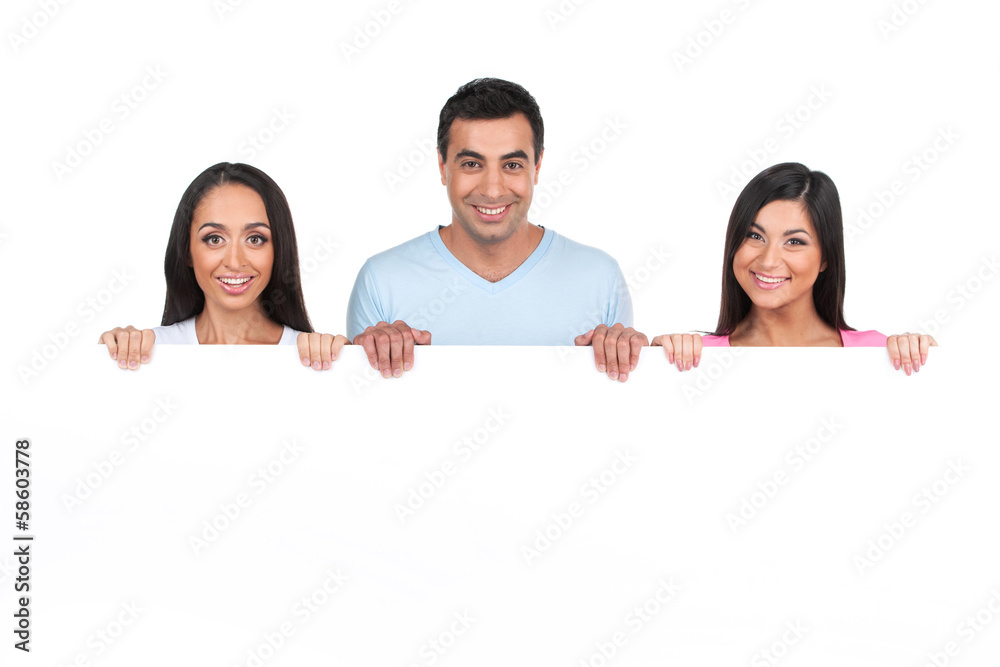Group of Indian people standing behind blank poster. Stock Photo ...
