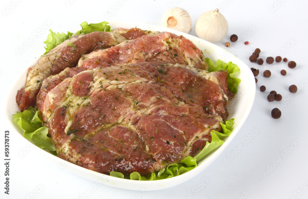 Meat marinating in olive oil with garlic Stock Photo | Adobe Stock