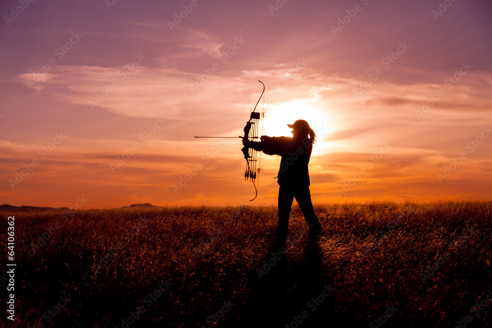 Woman Bowhunter in Sunset Stock Photo | Adobe Stock