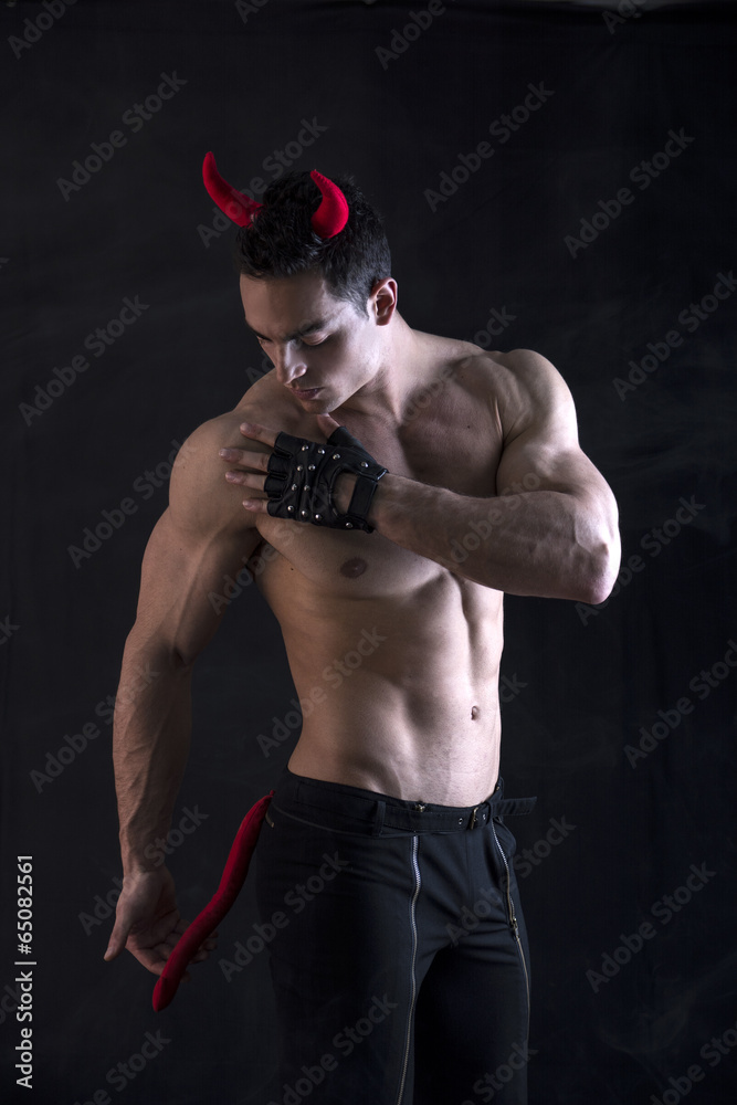 Shirtless muscular male bodybuilder dressed with devil costume Stock ...