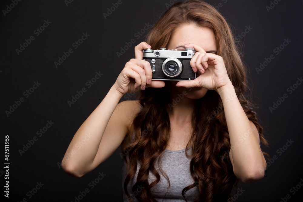 beautiful girl with a camera Stock Photo | Adobe Stock