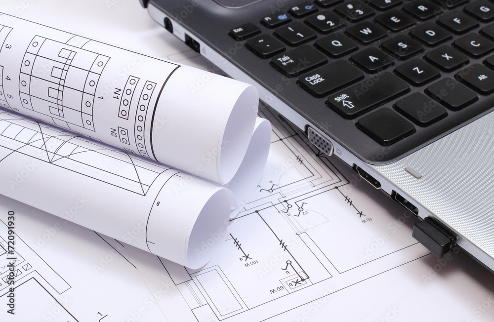 Electrical diagrams, construction drawings and laptop Stock Photo ...
