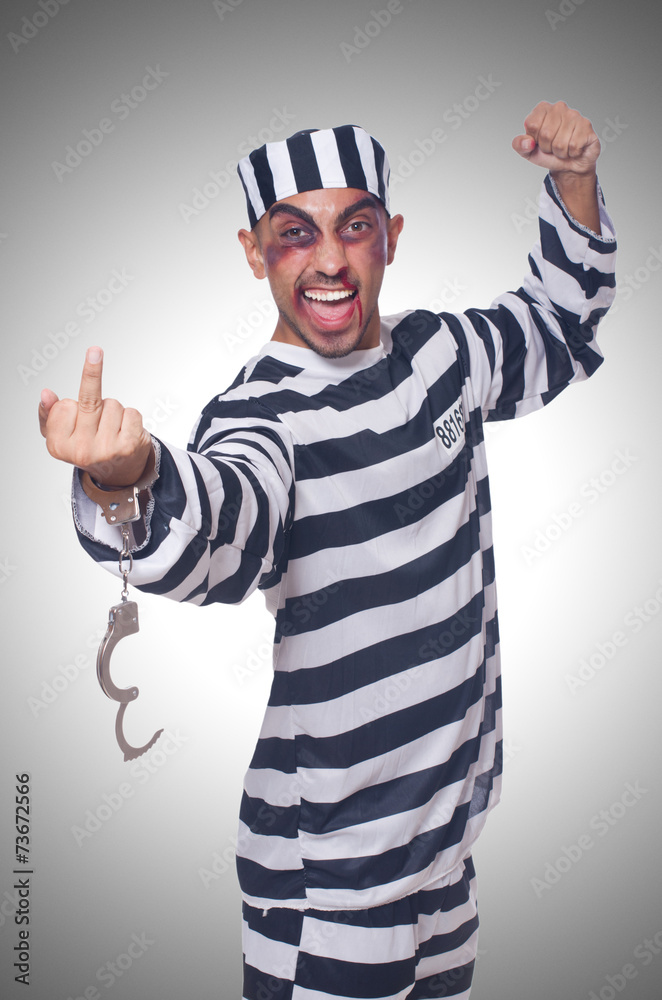 Badly bruised prisoner with handcuffs Stock Photo | Adobe Stock