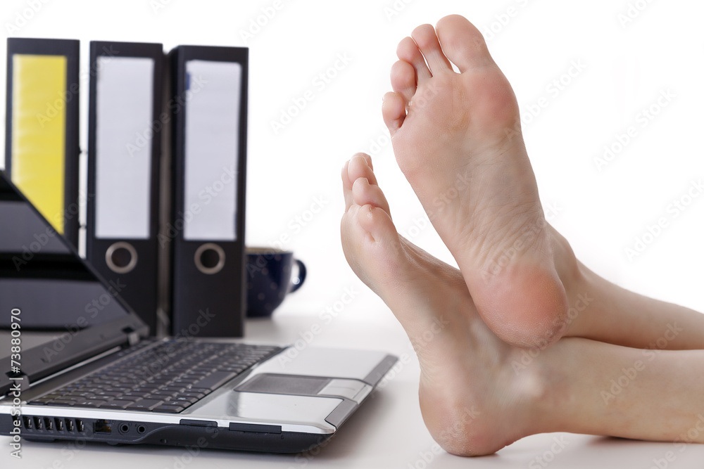 Bare feet on the desk Stock Photo | Adobe Stock