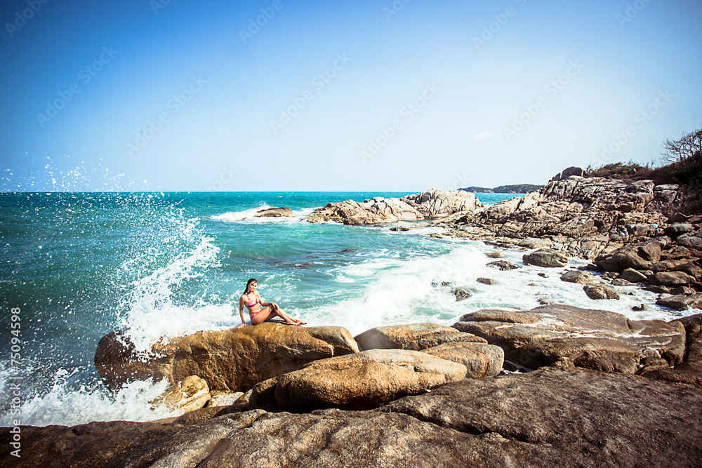 Young sexy woman in red bikini posing In front of sea on the Stock Photo | Adobe Stock