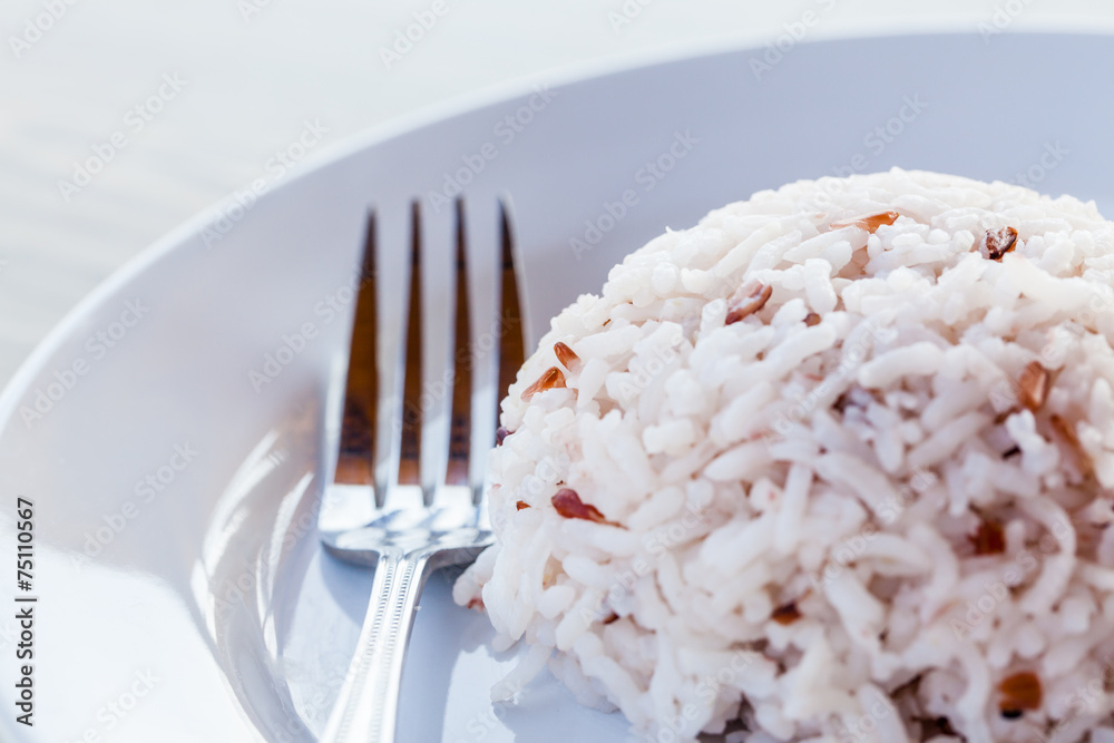 Some images of rice with fork in white dish Stock Photo | Adobe Stock