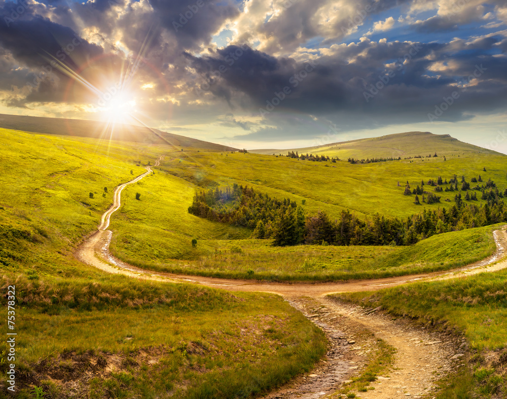 cross road on hillside meadow in mountain at sunrise at sunset Stock ...