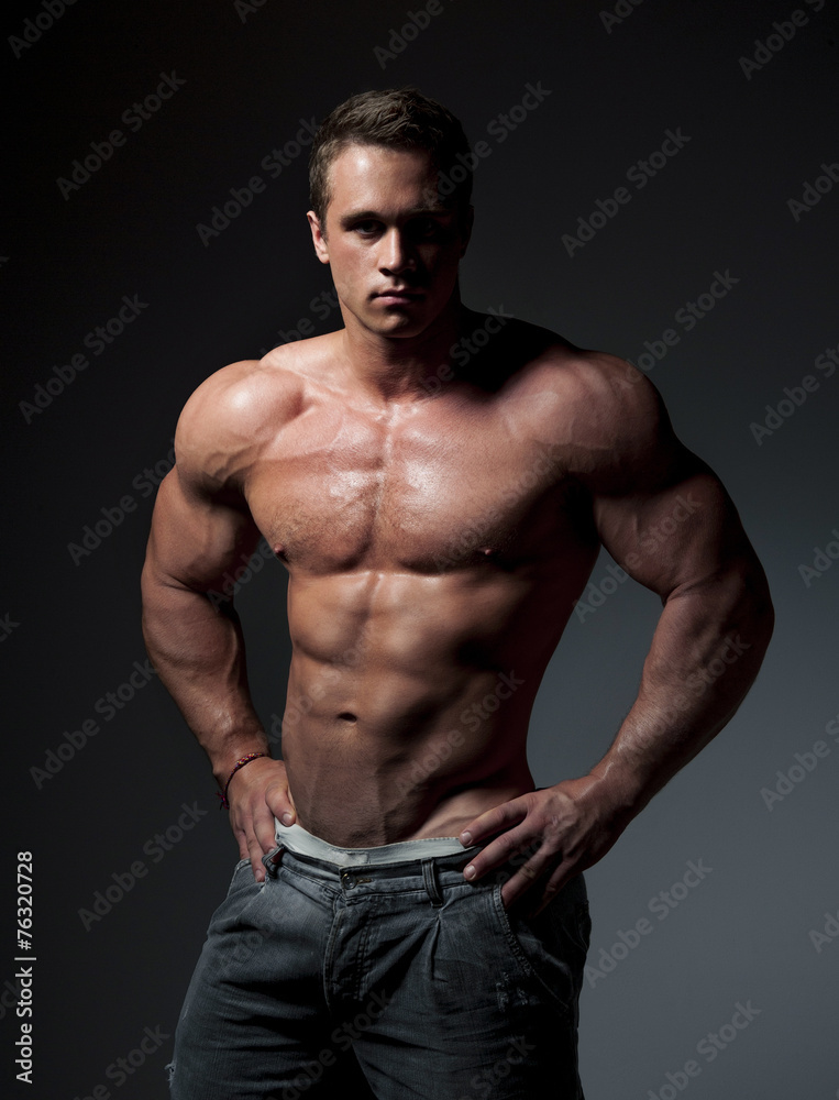 Bodybuilder posing Stock Photo | Adobe Stock