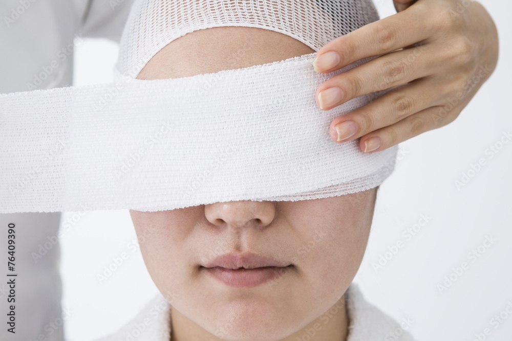 Women are wound a bandage on eyes Stock Photo | Adobe Stock
