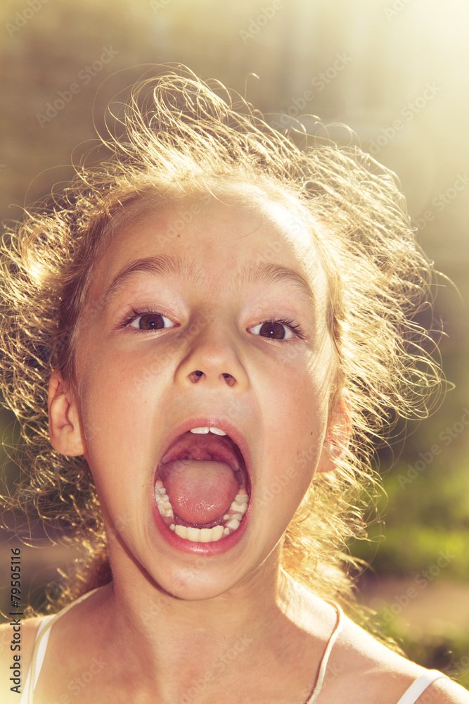 Shouting loud little girl at sunset Stock Photo | Adobe Stock