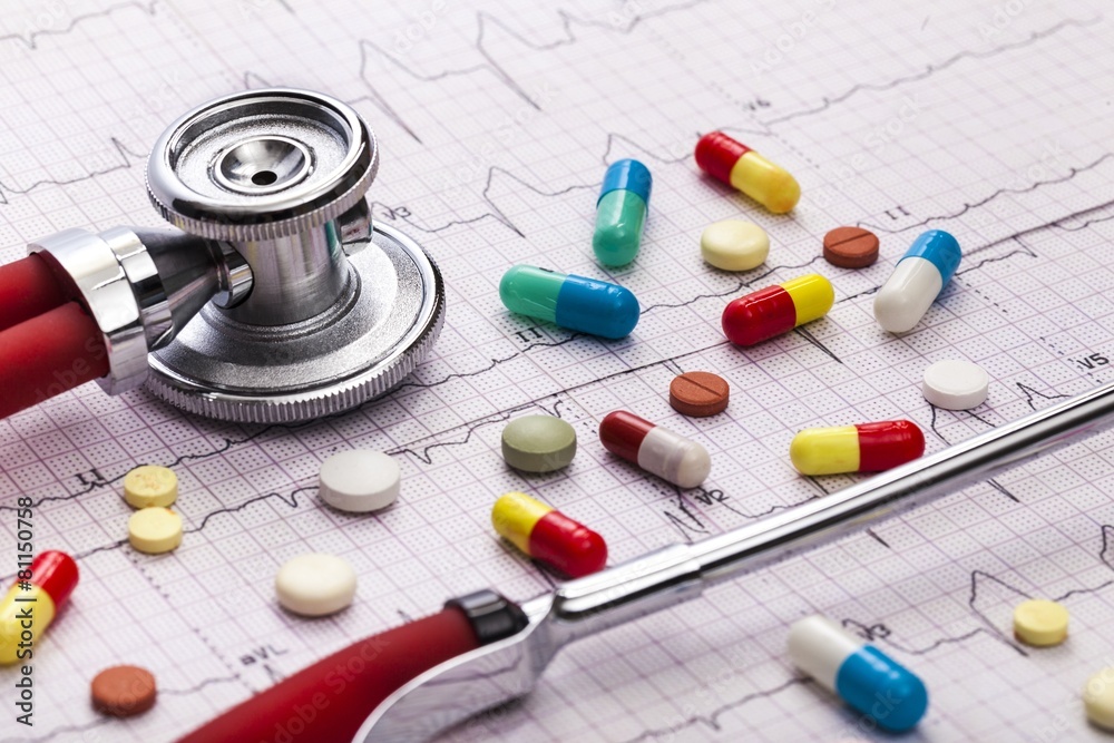 Drugs. Several tablets lie on an ekg. symbolic photo for Stock Photo ...