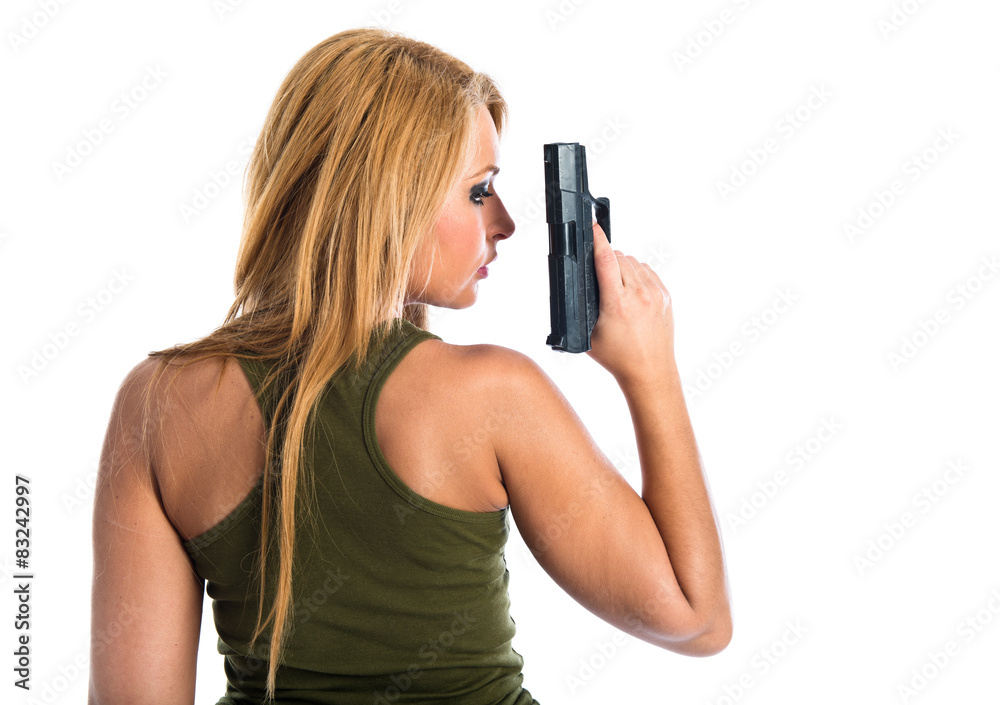 Military woman aiming a gun Stock Photo | Adobe Stock