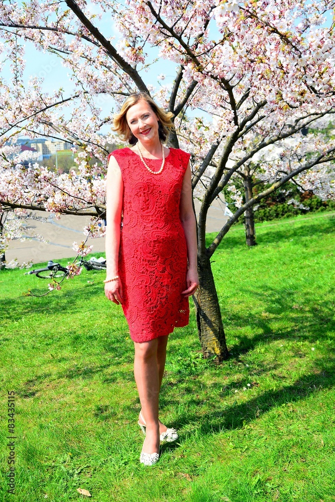 Beautiful female posing in the sakura garden Stock Photo | Adobe Stock