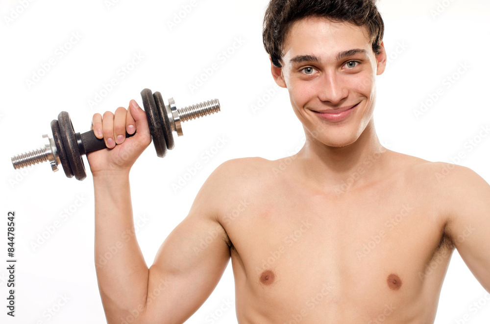 Skinny man training his bicep muscle. Beautiful teenager lifting a ...