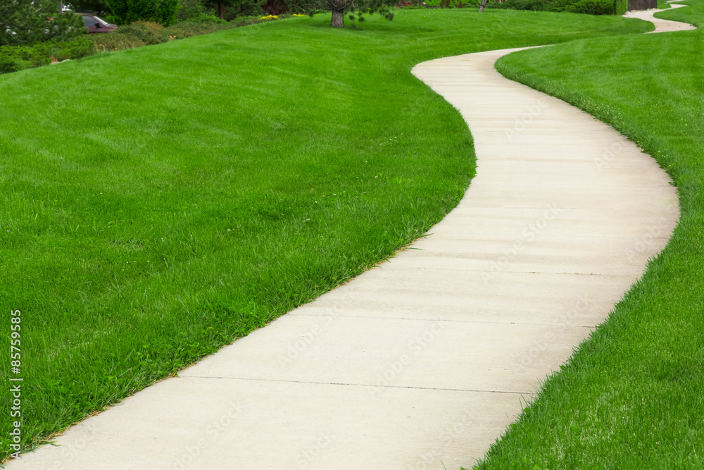 Pathway through green lawn Stock Photo | Adobe Stock