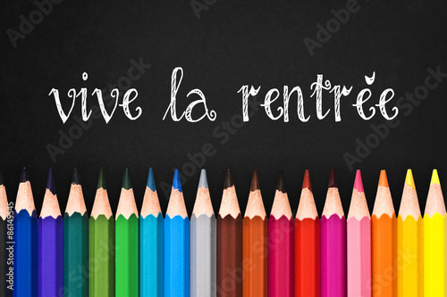 Vive la rentree (meaning Back to school) written on black chalkboard ...