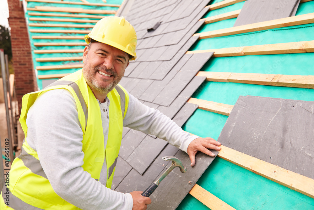 Construction Worker On Building Site Laying Slate Tiles Stock Photo ...