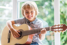 Little Boy Playing Guitar Free Stock Photo - Public Domain Pictures