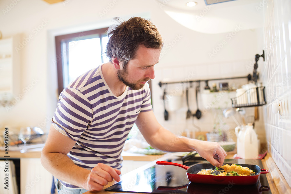 Man cooking Stock Photo | Adobe Stock