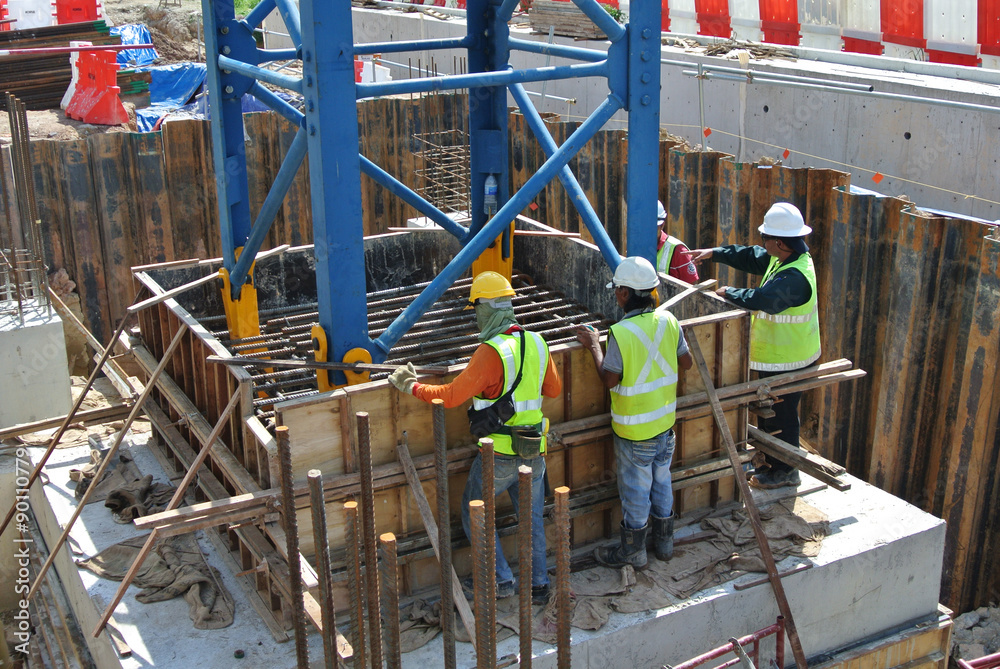 Group of construction workers fabricating pile cap formwork Stock Photo ...