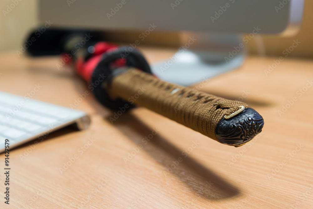 Japanese katana sword on a computer table in office room Stock Photo ...