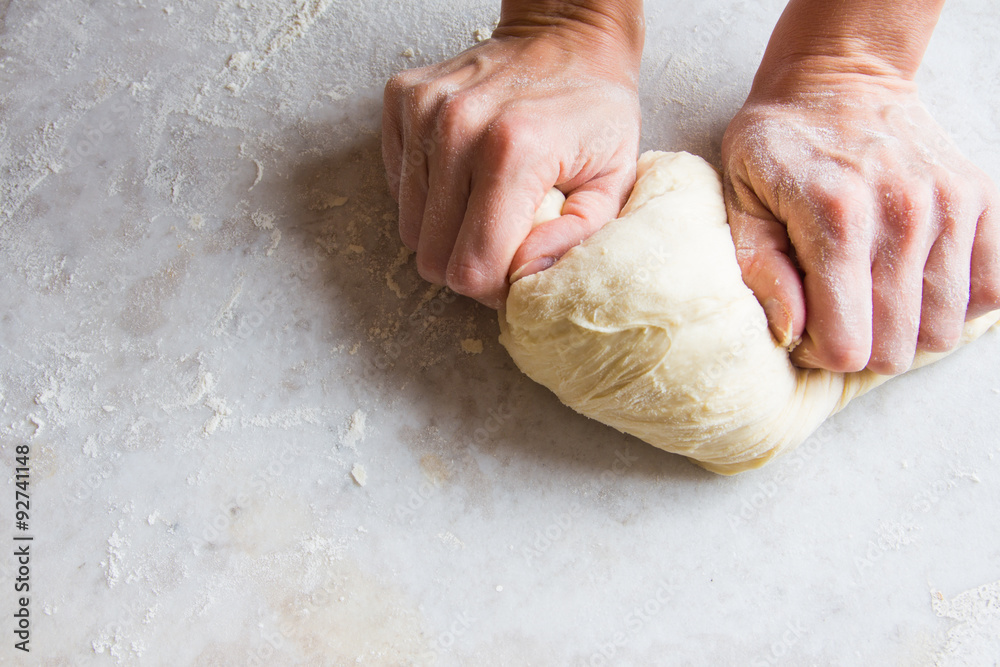 Hands kneading dough Stock Photo | Adobe Stock