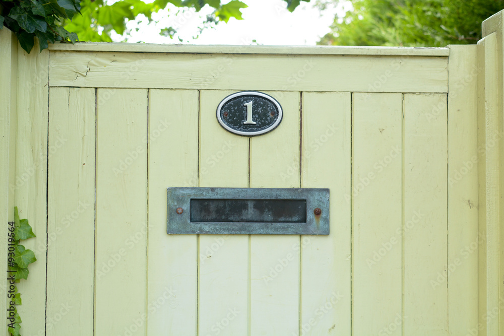 House number one sign and letterbox on gate to property Stock Photo ...
