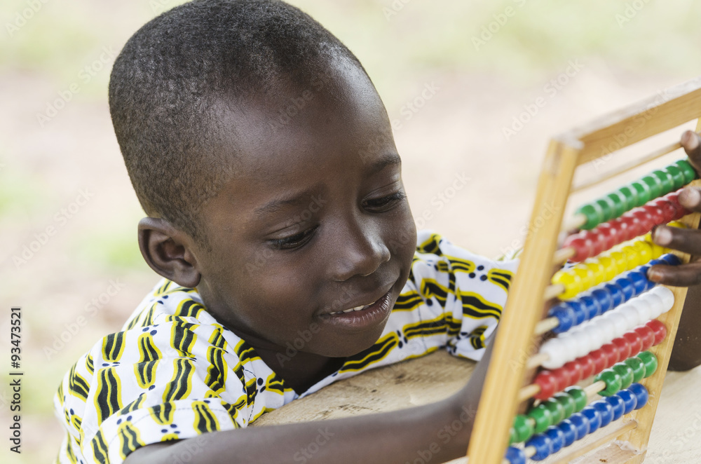 Learning symbol: young African boy learning his lesson in first grade ...