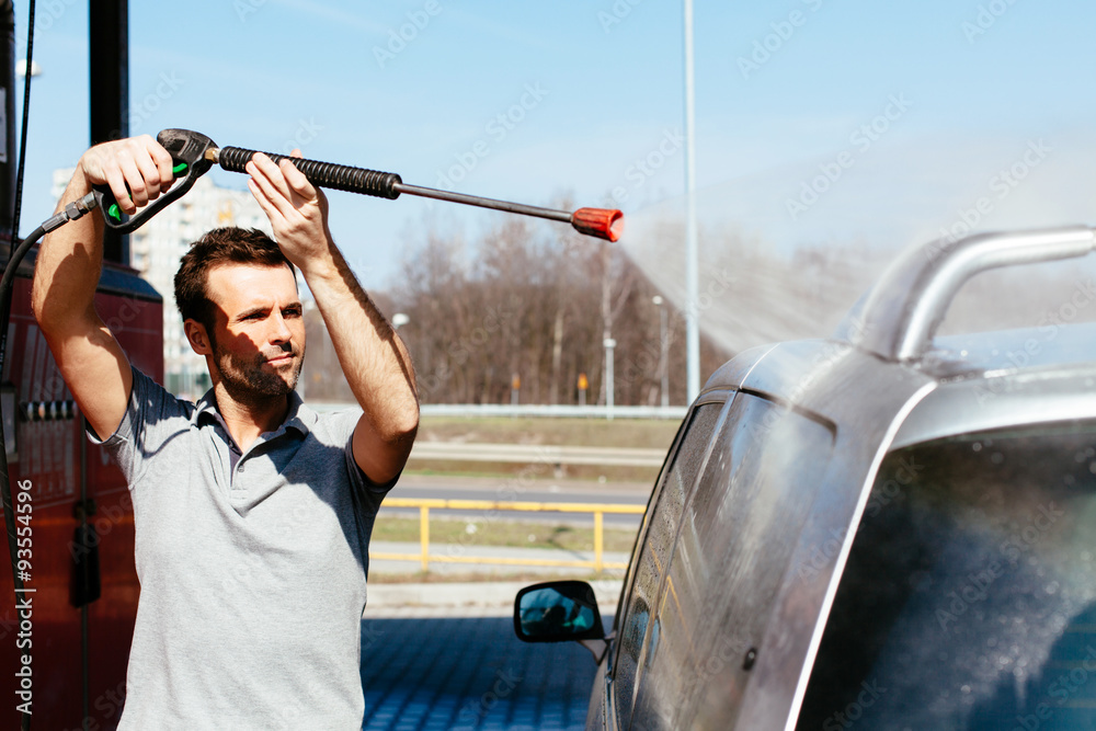 Final splash and it's done! Young man spraying his car clean Stock ...