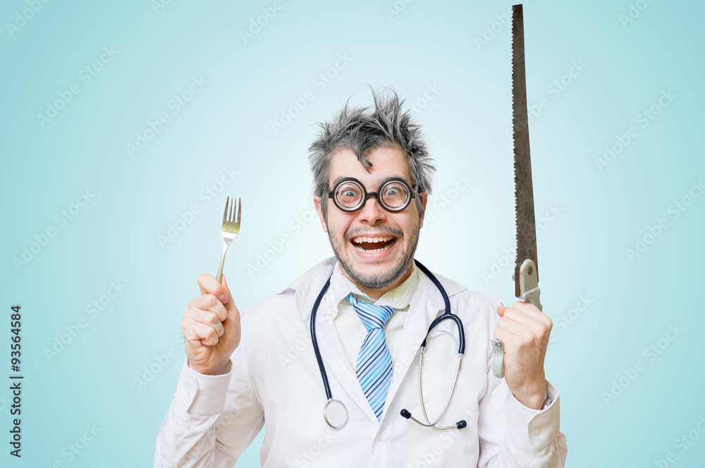 Funny wacky and crazy surgeon doctor holds unusual surgical instruments ...