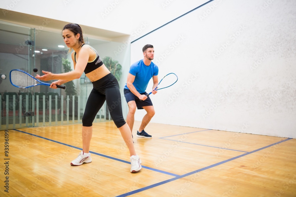 Couple play some squash together Stock Photo | Adobe Stock