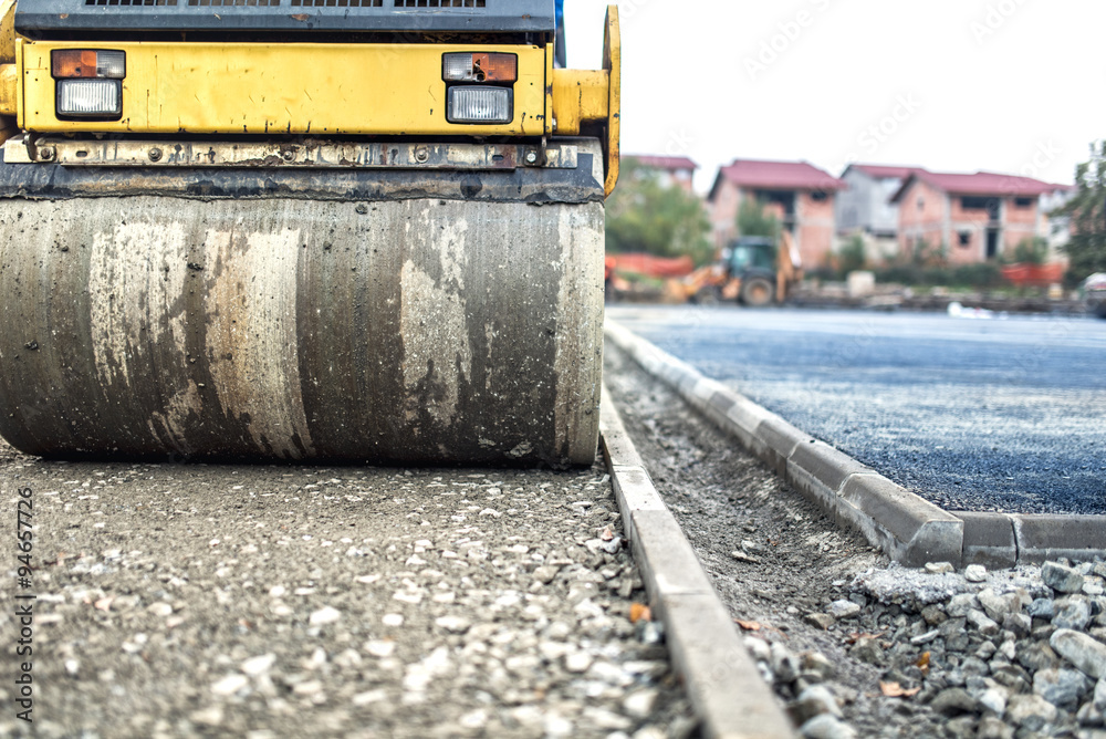 vibration roller compactor at road construction and reparing asphalt ...